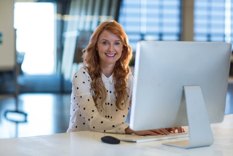 Portrait of Smiling Woman Using Computer Stock Photo - Image of looking ...