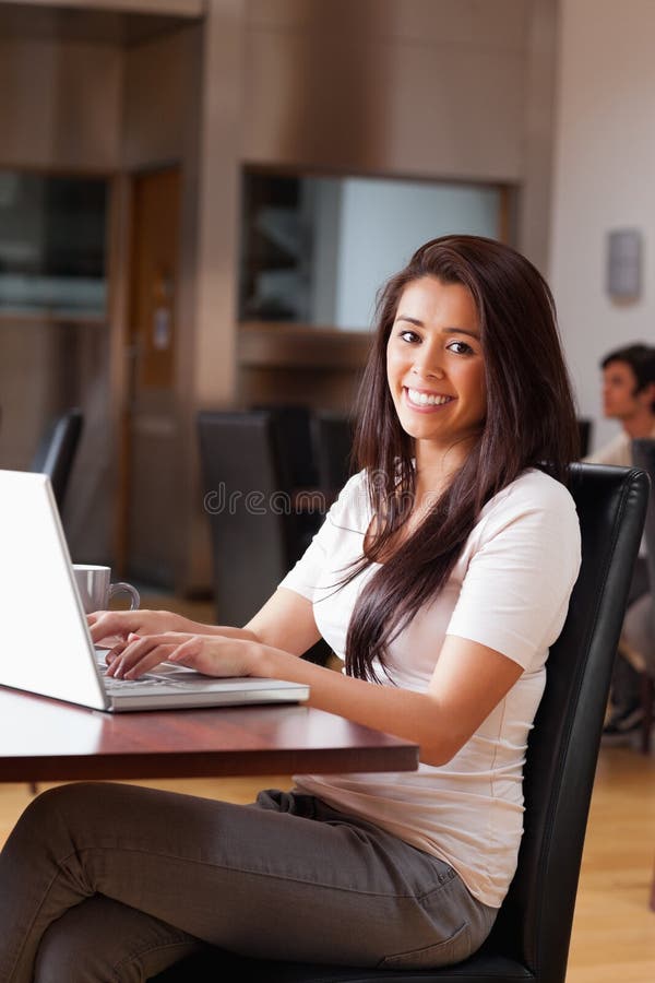 Portrait of a Smiling Woman Using a Notebook Stock Image - Image of ...