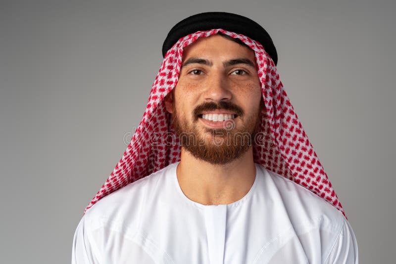 Portrait of Smiling Young Arab Man on Gray Background Stock Photo ...