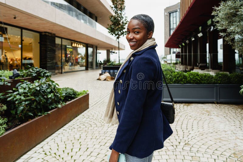 Portrait of Smiling Young Black Woman Standing in the Street Stock ... Portrait of Smiling Young Black Woman Standing in the Street Stock ...