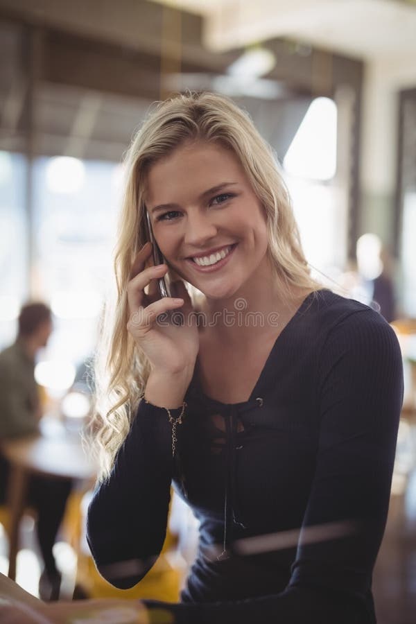 Portrait of Smiling Young Blond Woman Talking on Mobile Phone Stock ... Portrait of Smiling Young Blond Woman Talking on Mobile Phone Stock ...