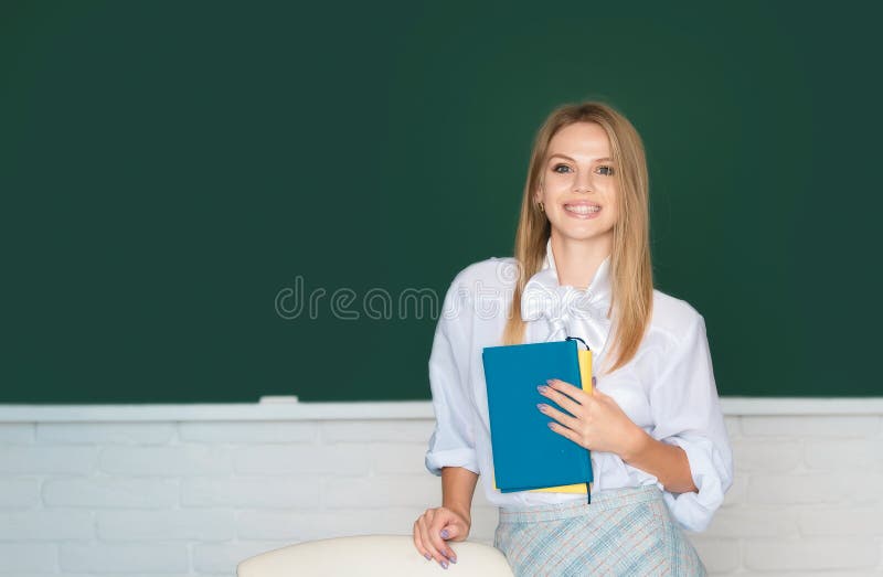 Portrait of Smiling Young College Student Studying in Classroom ...