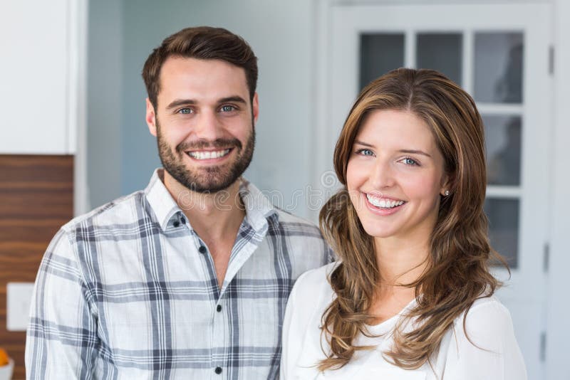 Portrait of Smiling Young Couple Stock Image - Image of indoors, hair ...
