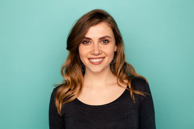 Portrait of Smiling Young Lady with White Teeth Standing in a Studio ...