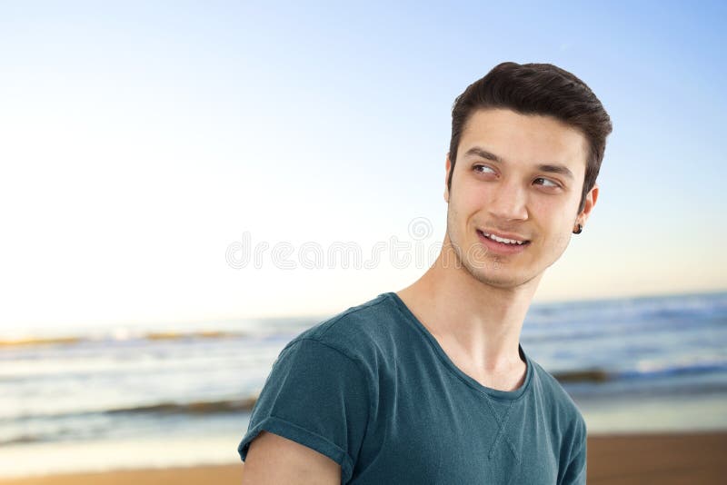 Portrait of Smiling Young Man on Beach Stock Photo - Image of holiday ...
