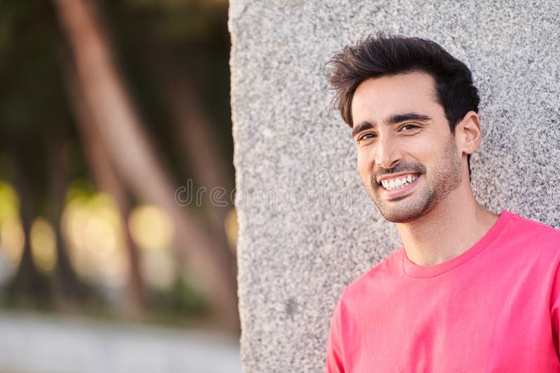 Portrait of a Smiling Young Man. Close Up Outside Shot of Happy ... Portrait of a Smiling Young Man. Close Up Outside Shot of Happy ...