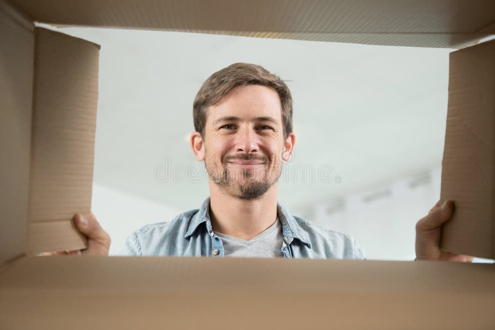 Portrait Smiling Young Man Looking into Box Stock Photo - Image of rent ...