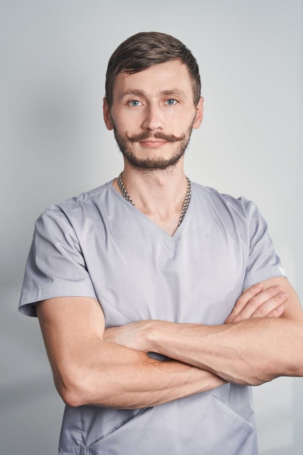 Smiling Young Caucasian Man Masseur Looking At Camera Close Up Portrait