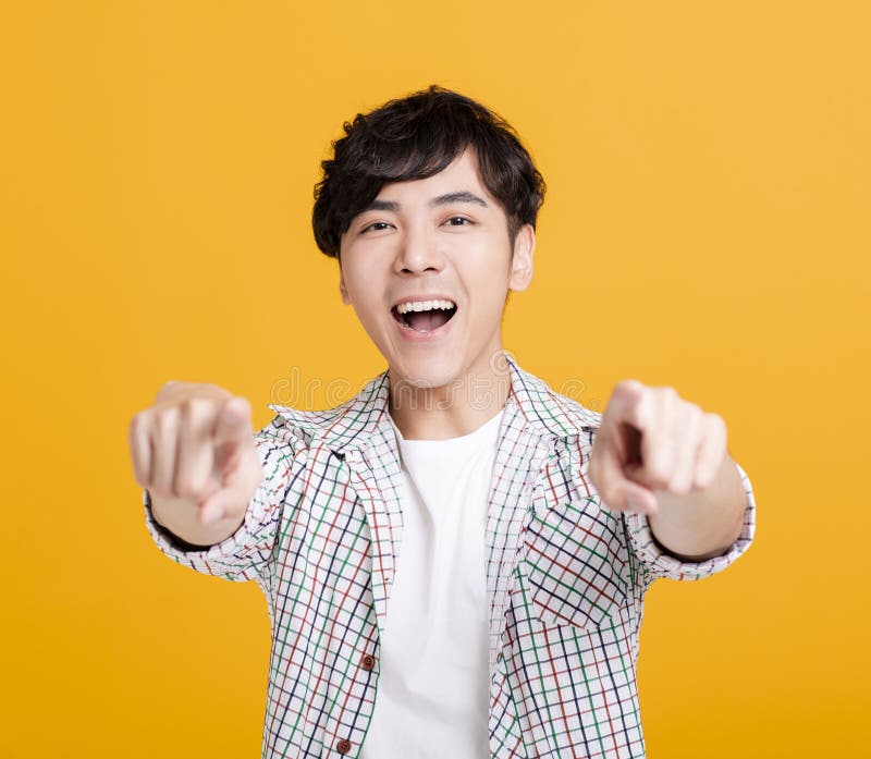 Portrait of Smiling Young Man Pointing Finger at Camera Stock Photo ... Portrait of Smiling Young Man Pointing Finger at Camera Stock Photo ...