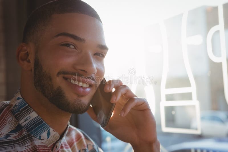 Portrait of Man Talking on Mobile Phone in Cafe Stock Image - Image of ...