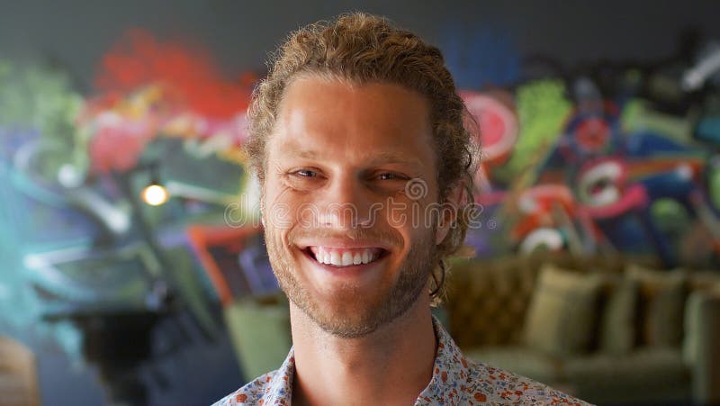 Portrait of Smiling Young Man in Urban Setting with Graffiti Covered ...