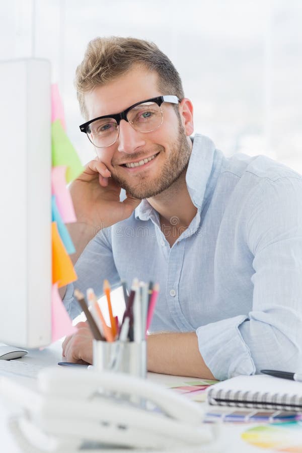 Portrait of a Smiling Young Man Using Computer Stock Image - Image of ...