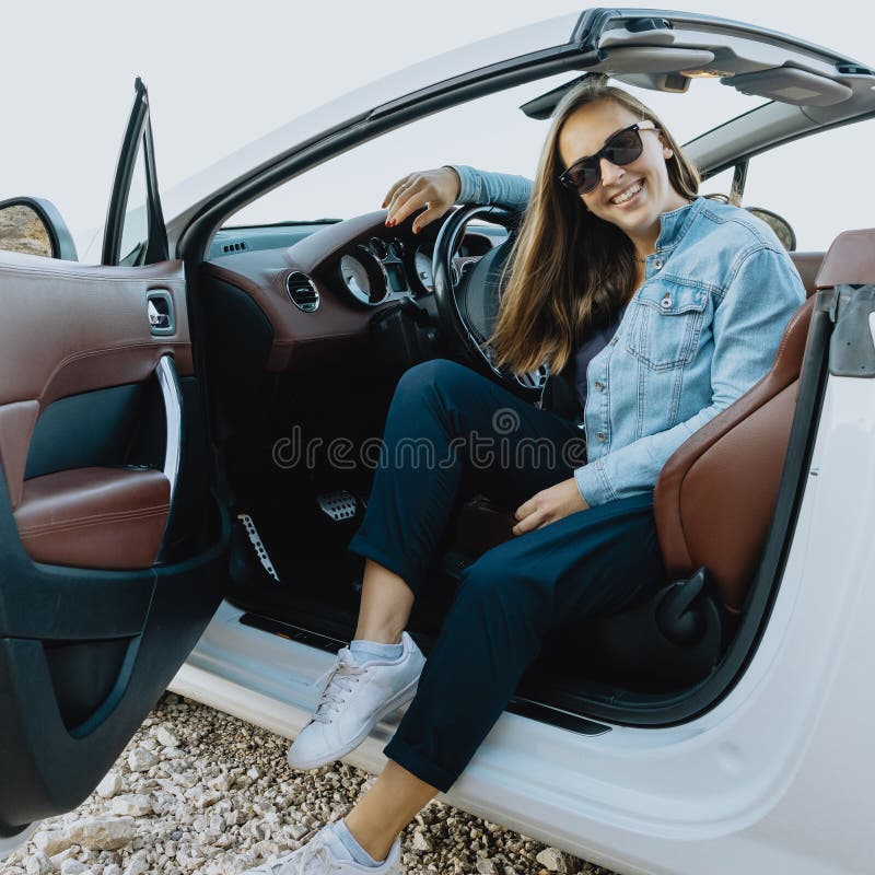 Portrait of Smiling Young Woman in Car Stock Image - Image of music ...