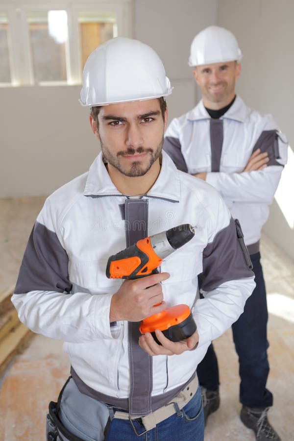 Portrait Smiling Young Worker with Drill Stock Photo - Image of ...