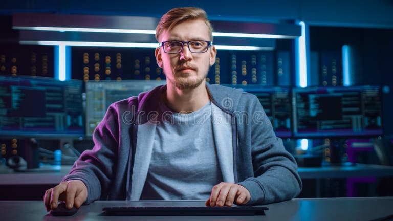 Portrait of Software Developer / Hacker Wearing Glasses Sitting at His ...