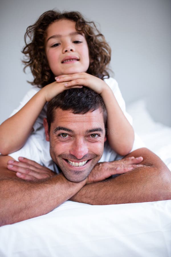 Portrait of a Son Lying on Fathers Back Stock Photo - Image of ...