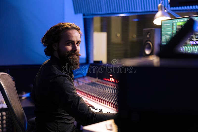 Portrait of Sound Designer Working with Mixing Console and Daw Software ...