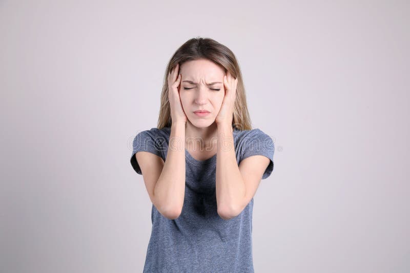 Portrait of Stressed Young Woman on Light Background Stock Image ...