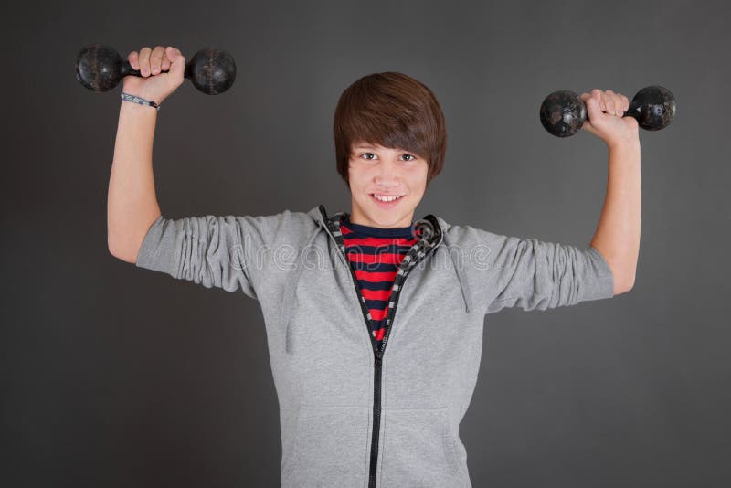 Portrait of Strong Boy with Dumbbells Stock Image - Image of grey ...