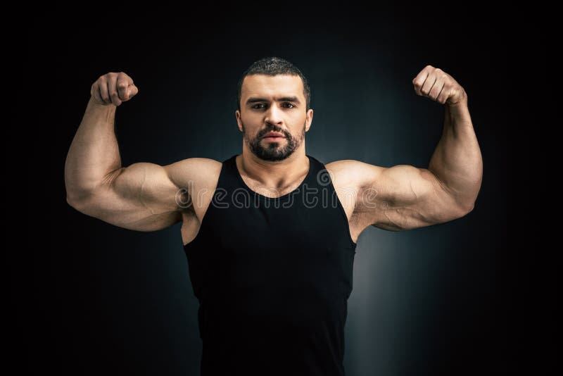 Portrait of Strong Man Showing Muscles Stock Photo - Image of ...