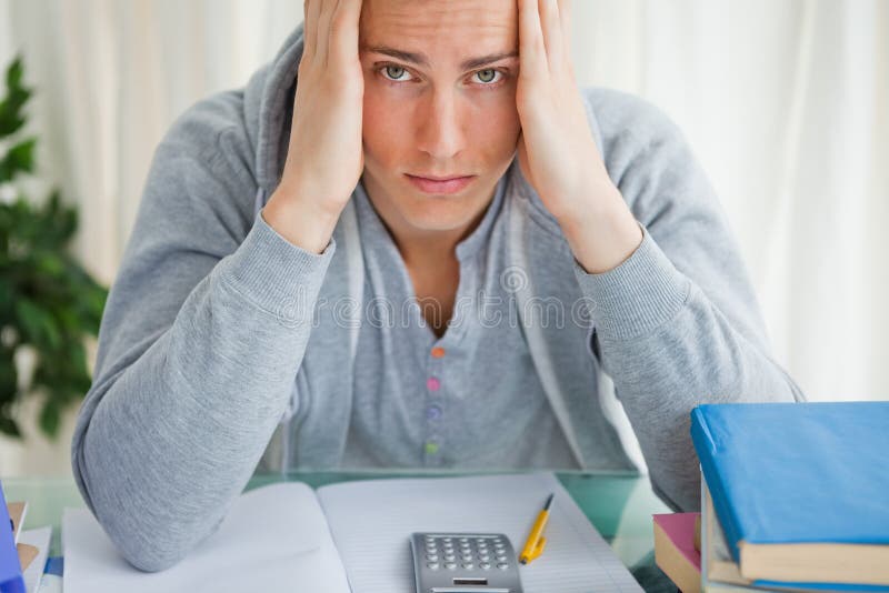 Distressed Student in Front of His Books Stock Photo - Image of holding ...