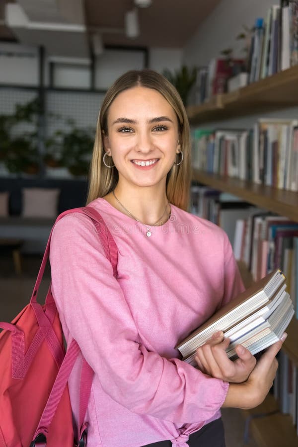 Portrait of Student Looking at Camera, Posing in College Library Stock ...
