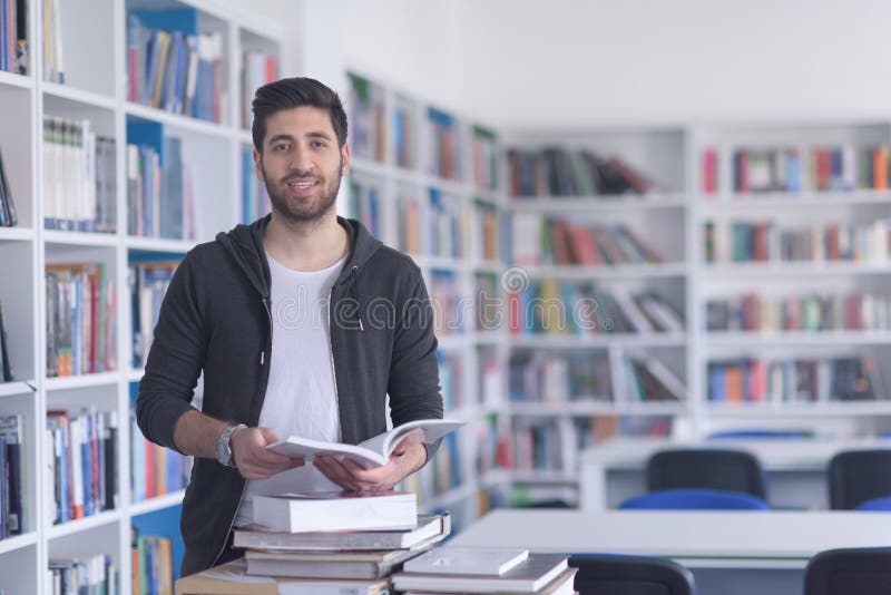 Portrait of Student while Reading Book in School Library Stock Image ...