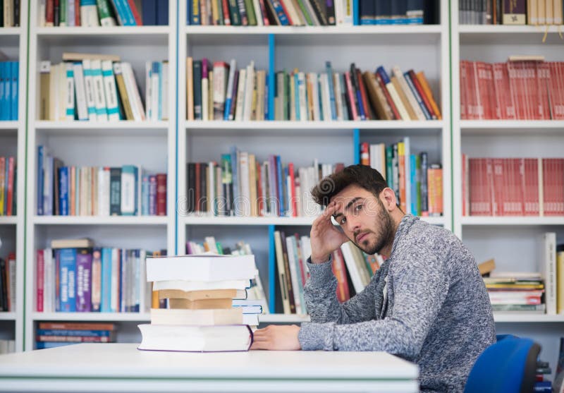 Portrait of Student while Reading Book in School Library Stock Image ...