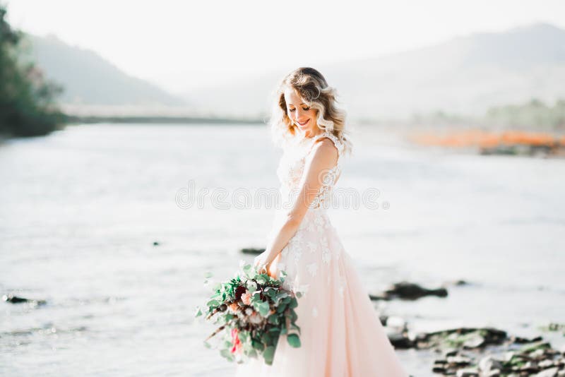 Portrait of Stunning Bride with Long Hair Standing by the River Stock ...