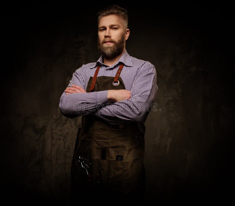 Portrait of Stylish Barber with Beard and Professional Tools on a Dark ...