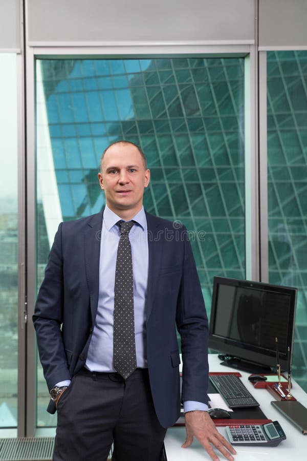 Portrait of Successful Businessman in a Suit at Office Stock Photo ...