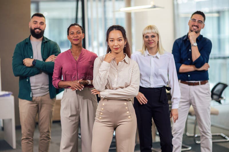 Successful Group of Business People at Modern Office Looking at Camera ...