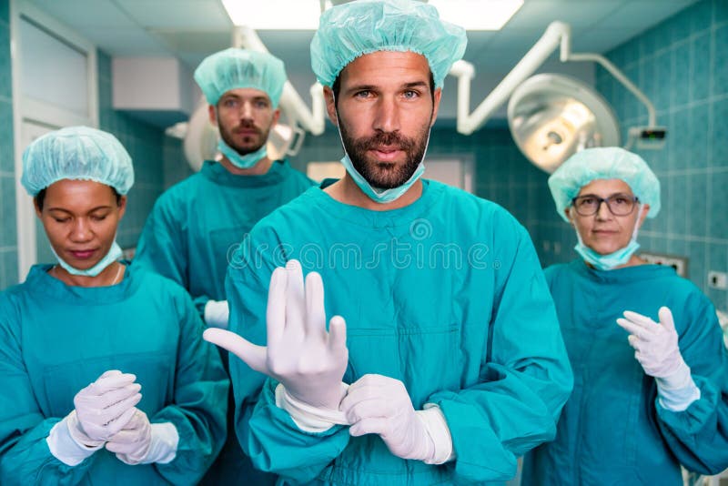 Portrait of Successful Team of Surgeon Standing in Operating Room ...
