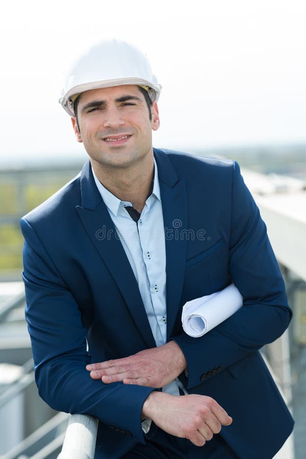 Portrait Suited Man Holding Rolled Up Papers Under Arm Stock Image ...