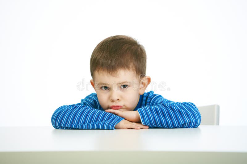 Portrait of Sullen Little Boy Sitting at Table Stock Image - Image of ...