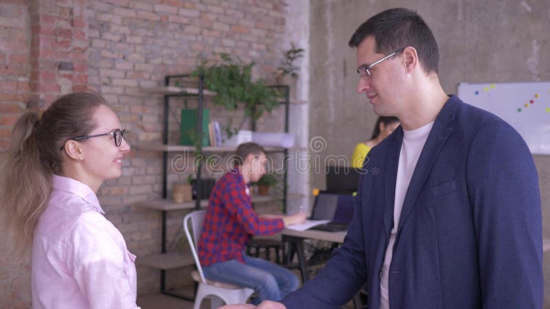 Portrait of Supervisor and New Employee Shake Hands on Background of ...