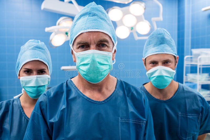 Portrait of Surgeon and Nurses Standing in Operation Room Stock Photo ...