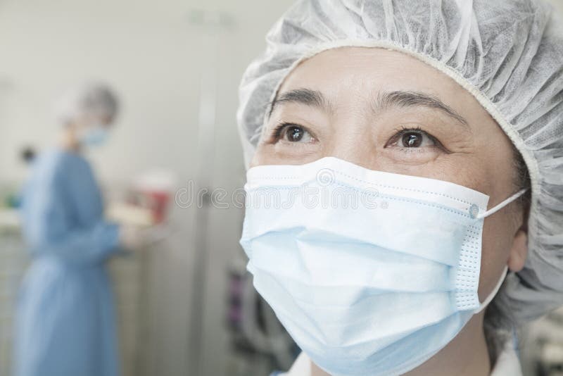 Portrait of Surgeon with Surgical Mask and Surgical Cap in the ...