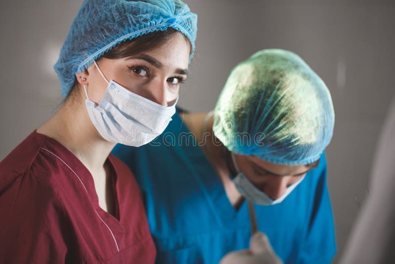 Portrait of Surgeons at Work, Operating in Uniform, Looking at Camera ...