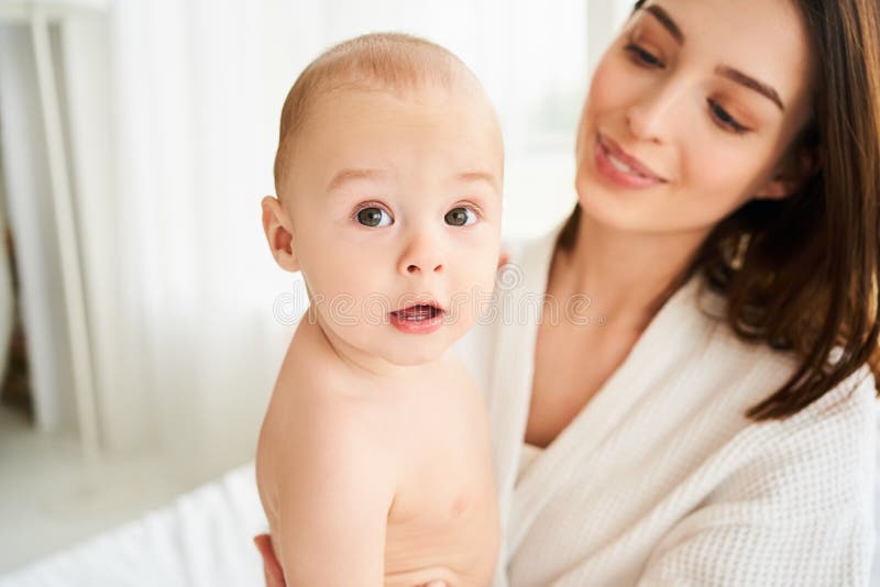 Portrait of a Surprised Calm Newborn Baby Boy in His Mother S Arms ... Portrait of a Surprised Calm Newborn Baby Boy in His Mother S Arms ...
