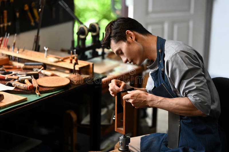 Portrait of Talented Artisan Sitting at His Workbench Surrounded by ...