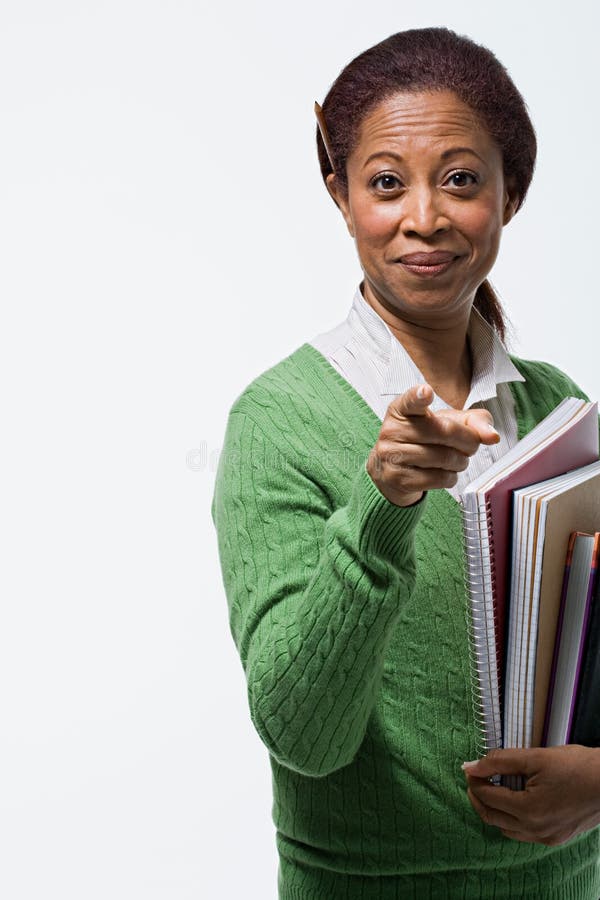 Portrait of Teacher Holding Books Stock Photo - Image of front ...