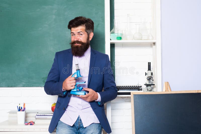 Portrait of Teacher Man Hold Microscope at School in Classroom at ...