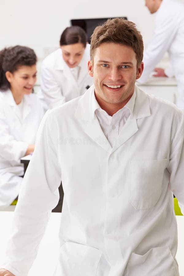 Portrait of Technician in Laboratory with Colleagues Stock Photo ...
