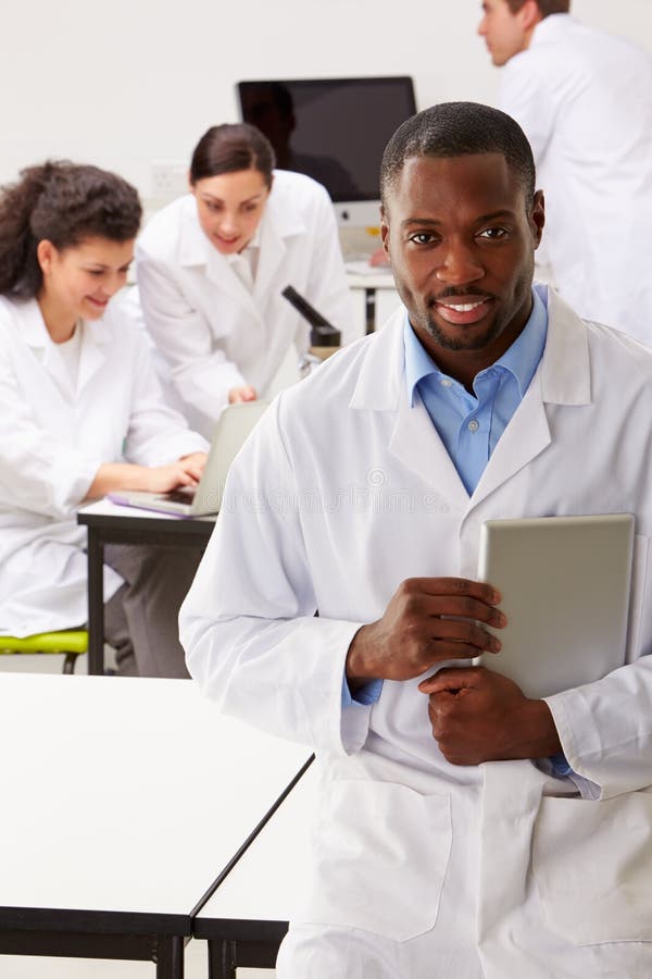 Portrait of Technician in Laboratory with Colleagues Stock Image ...