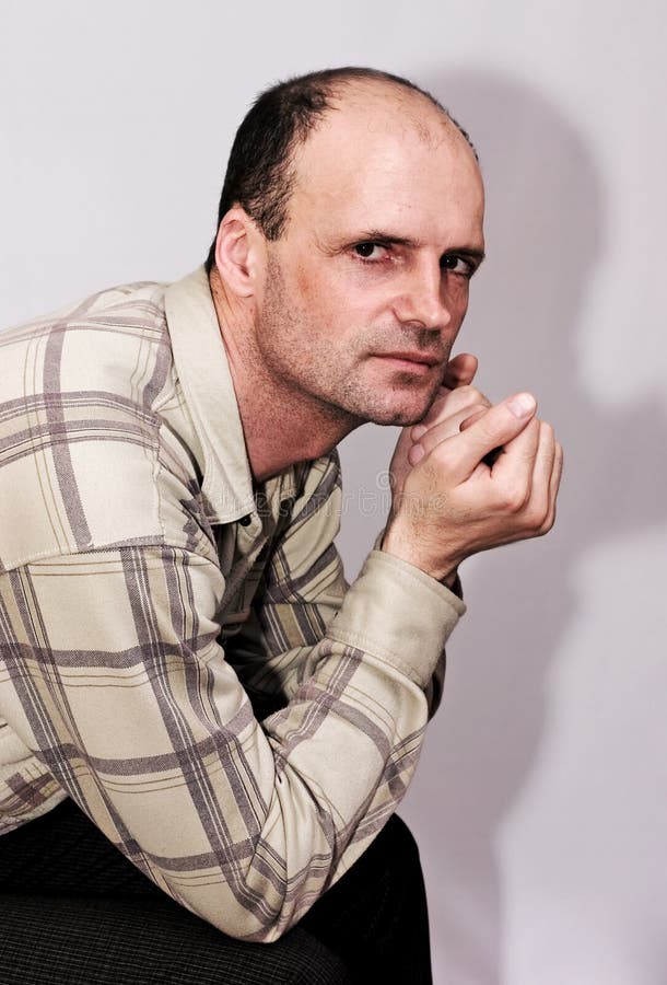 Portrait of Thin Sitting Man of Average Years Stock Photo - Image of ...