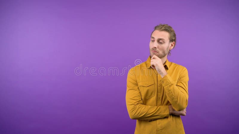 Portrait of a Thinking Man. Long Haired Man Isolated on Purple ...