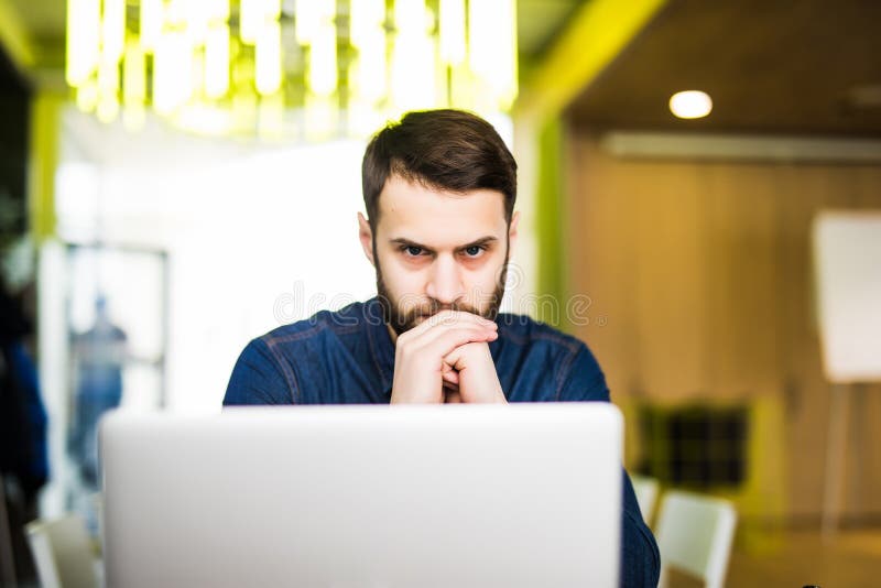 Portrait of Thinking Man Using Laptop Computer at Cafe Shop Stock Image ...