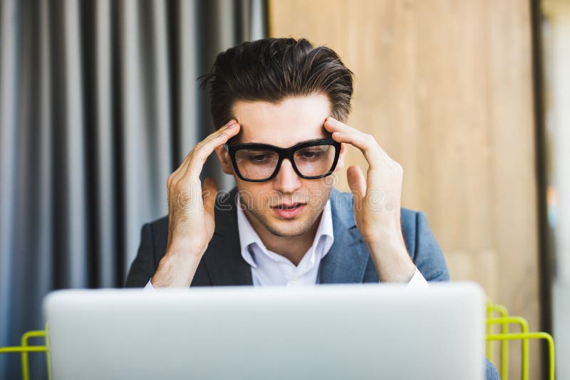 Portrait of Thinking Man Using Laptop Computer at Home. Stock Image ...