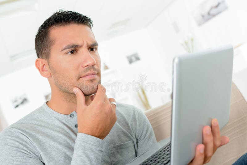 Portrait Thinking Man Using Laptop Computer at Home Stock Photo - Image ...
